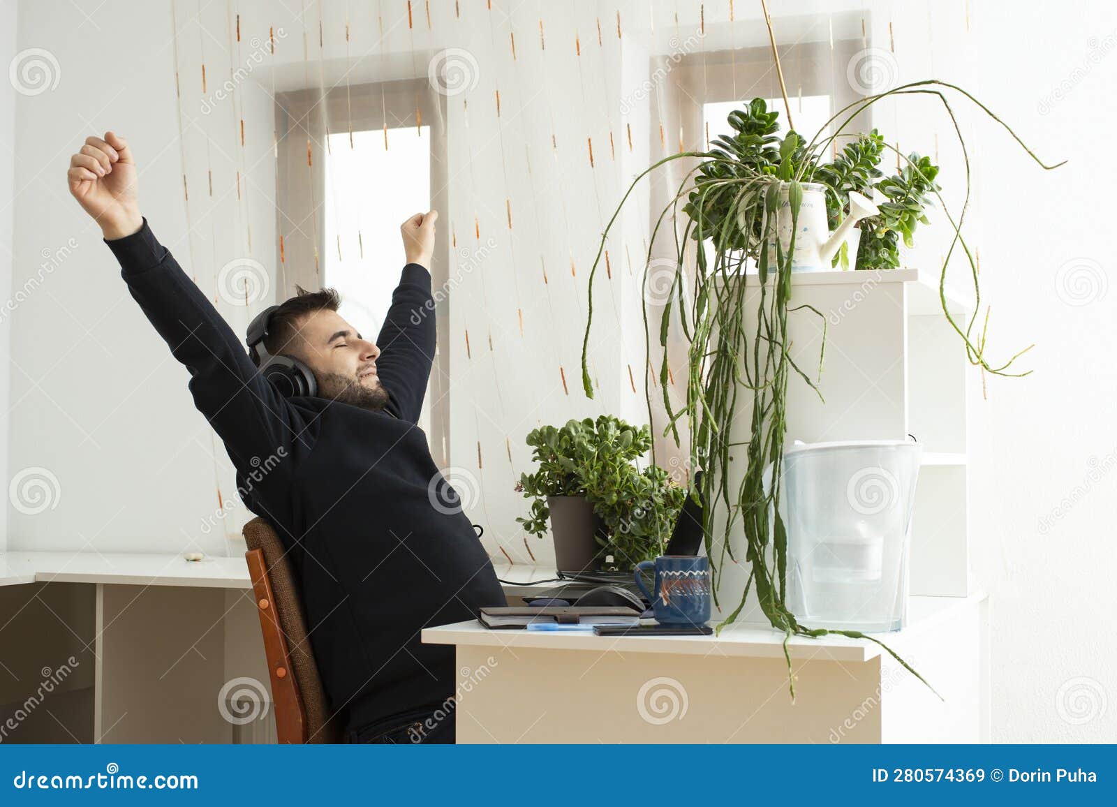 Computer Worker with Head Phones Sitting at Desk Stock Image - Image of ...