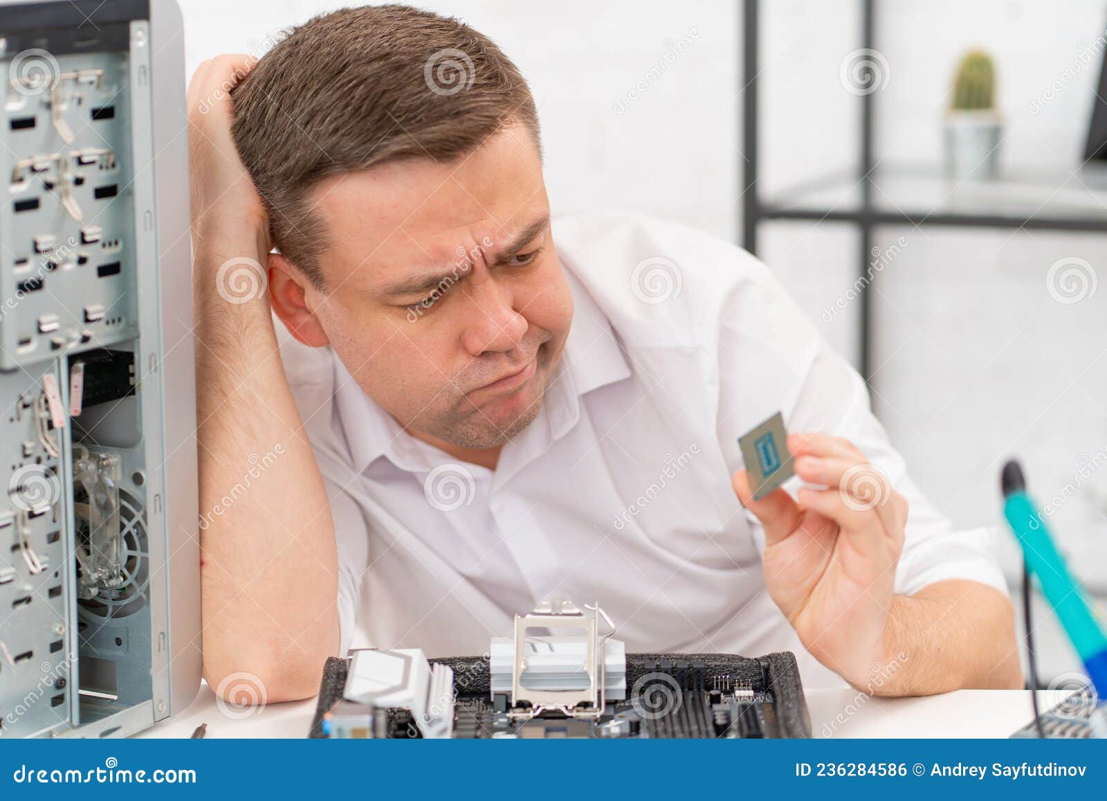 Computer Workshop. Professional Services. Sad Repairman with a ...