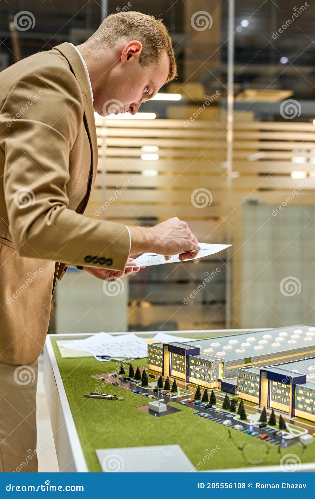 Concentrated Architect Man Working with Building Layout, Architectural ...