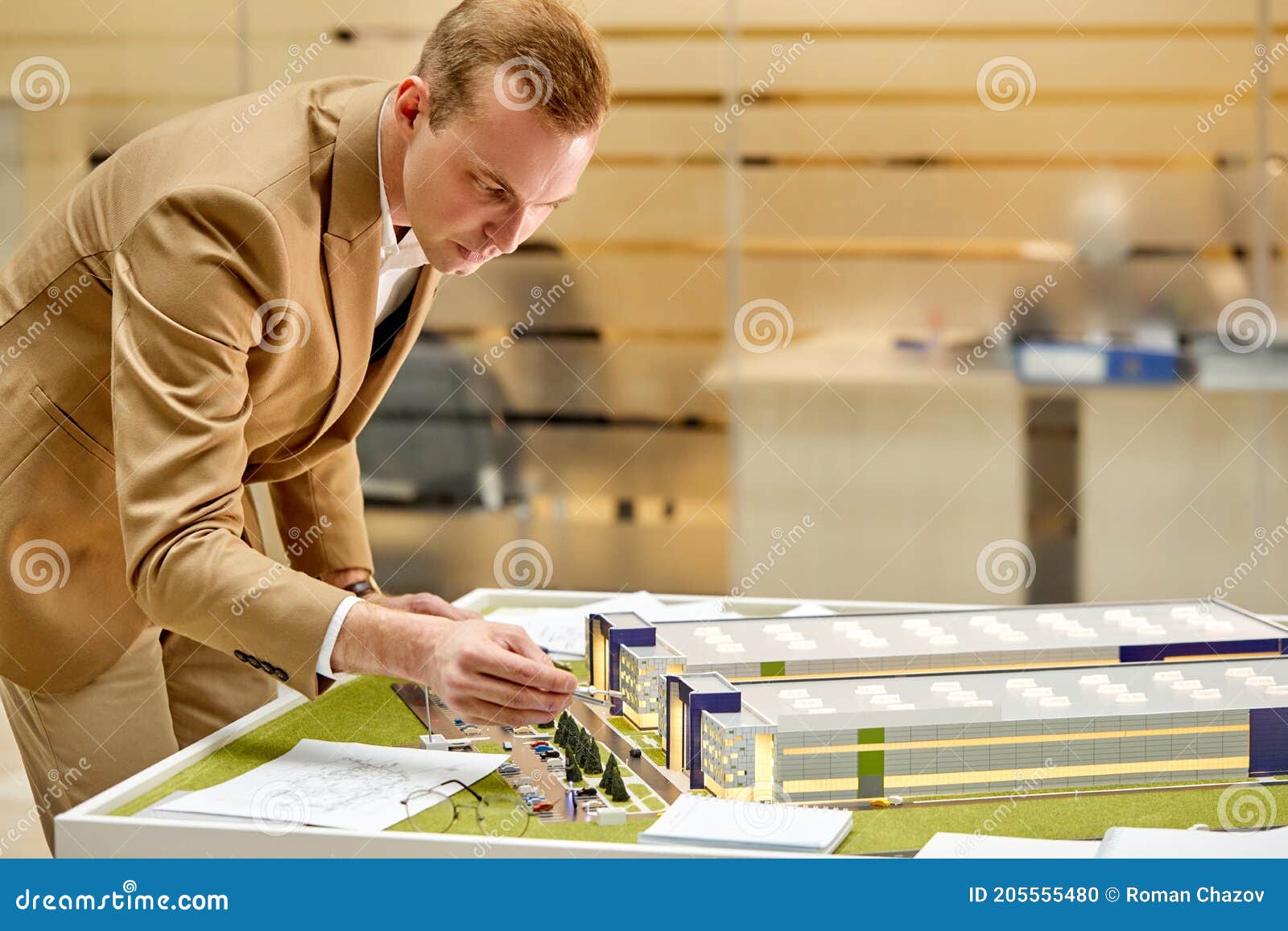 Concentrated Architect Man Working with Building Layout, Architectural ...