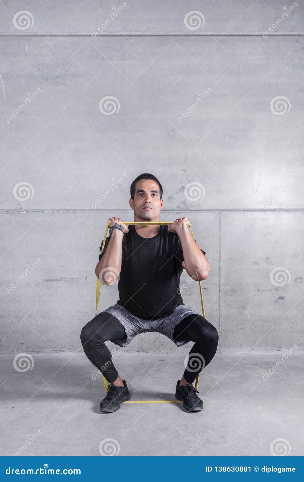 Focused Personal Trainer Doing Exercise with Elastic Band Stock Image ...