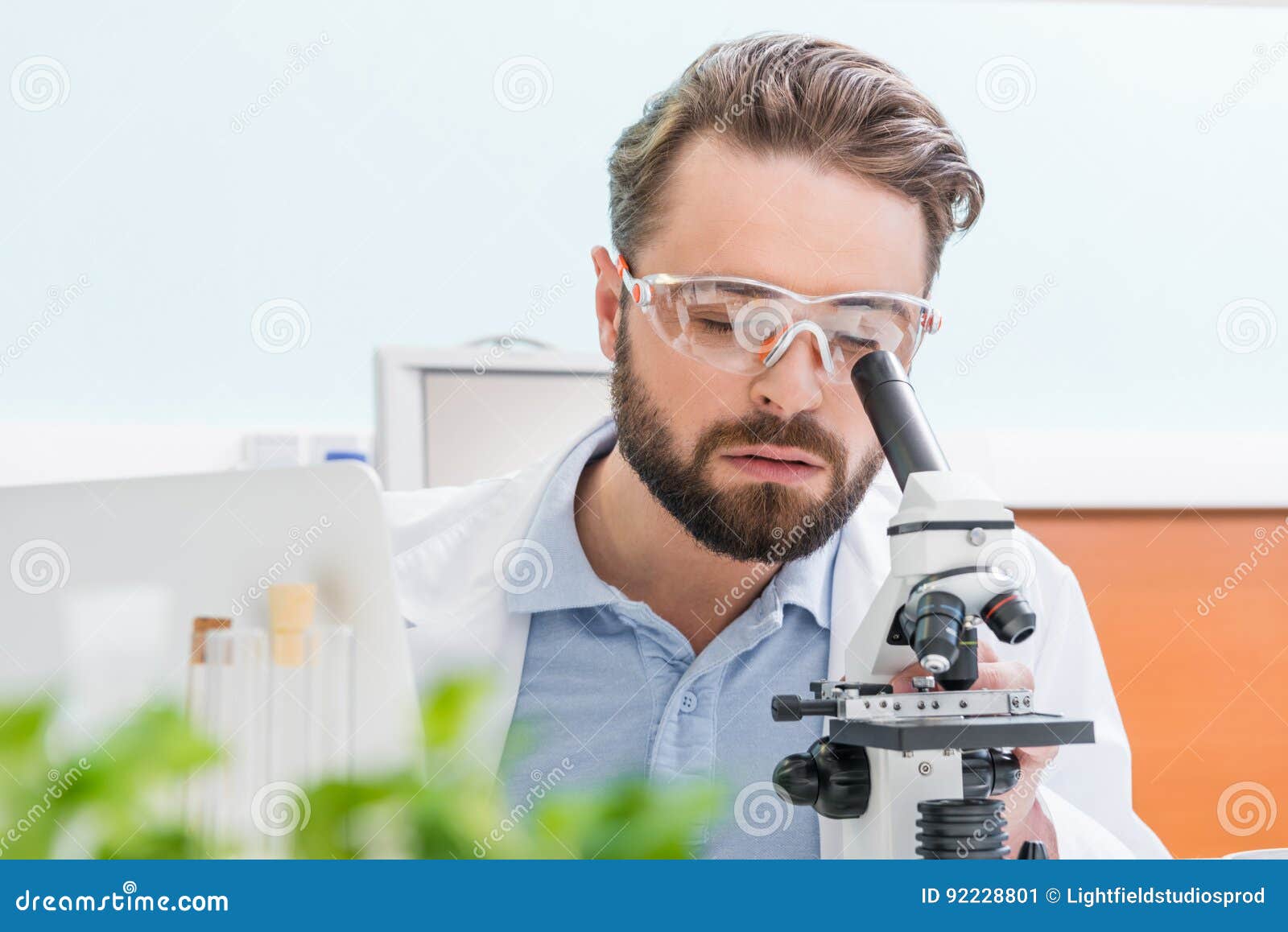 Concentrated Bearded Scientist Working with Microscope Stock Image ...
