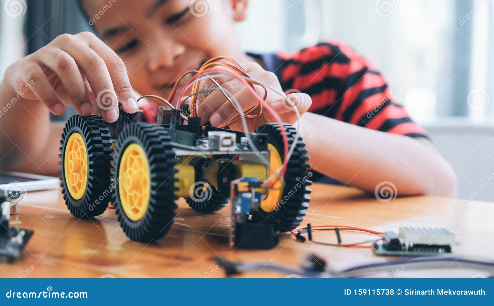 Concentrated Boy Creating Robot at Lab Stock Photo - Image of girl ...