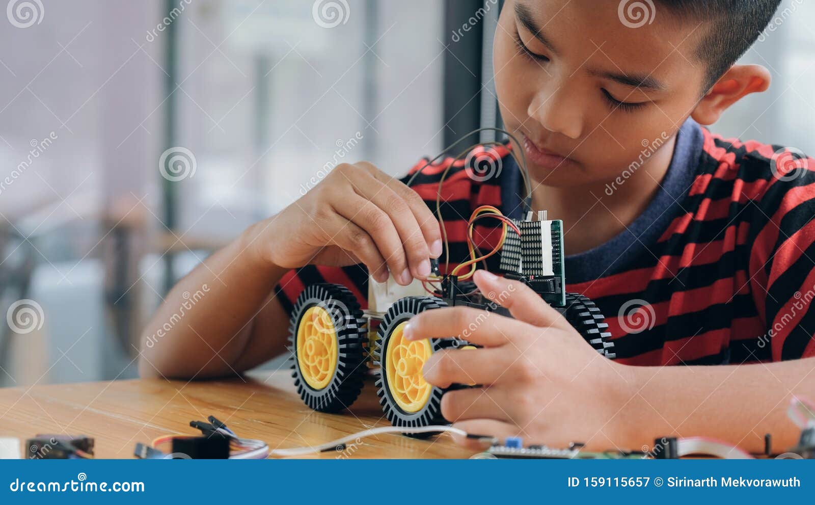 Concentrated Boy Creating Robot at Lab Stock Image - Image of candid ...