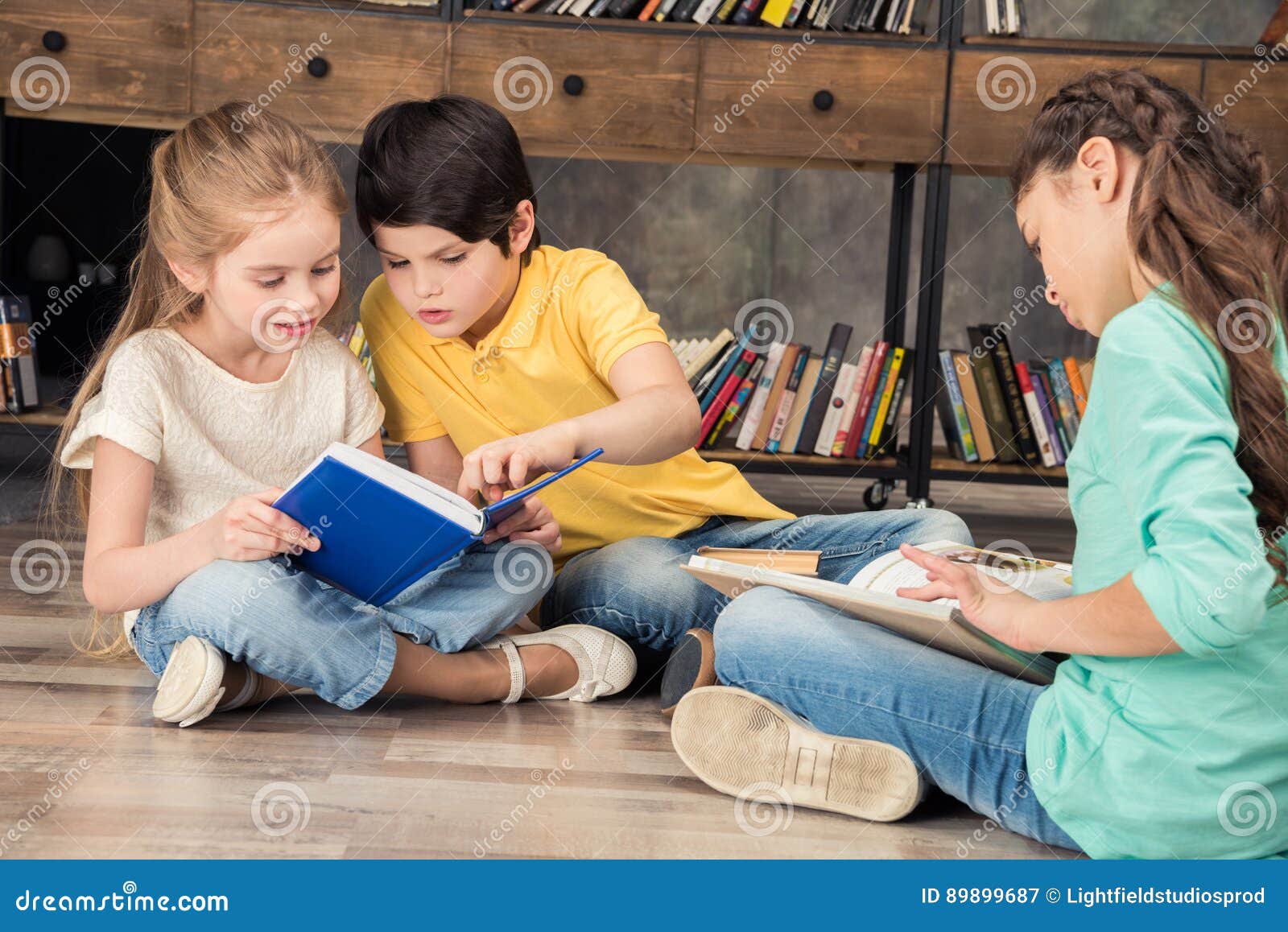 Concentrated Boy and Girls Reading Books Stock Image - Image of ...