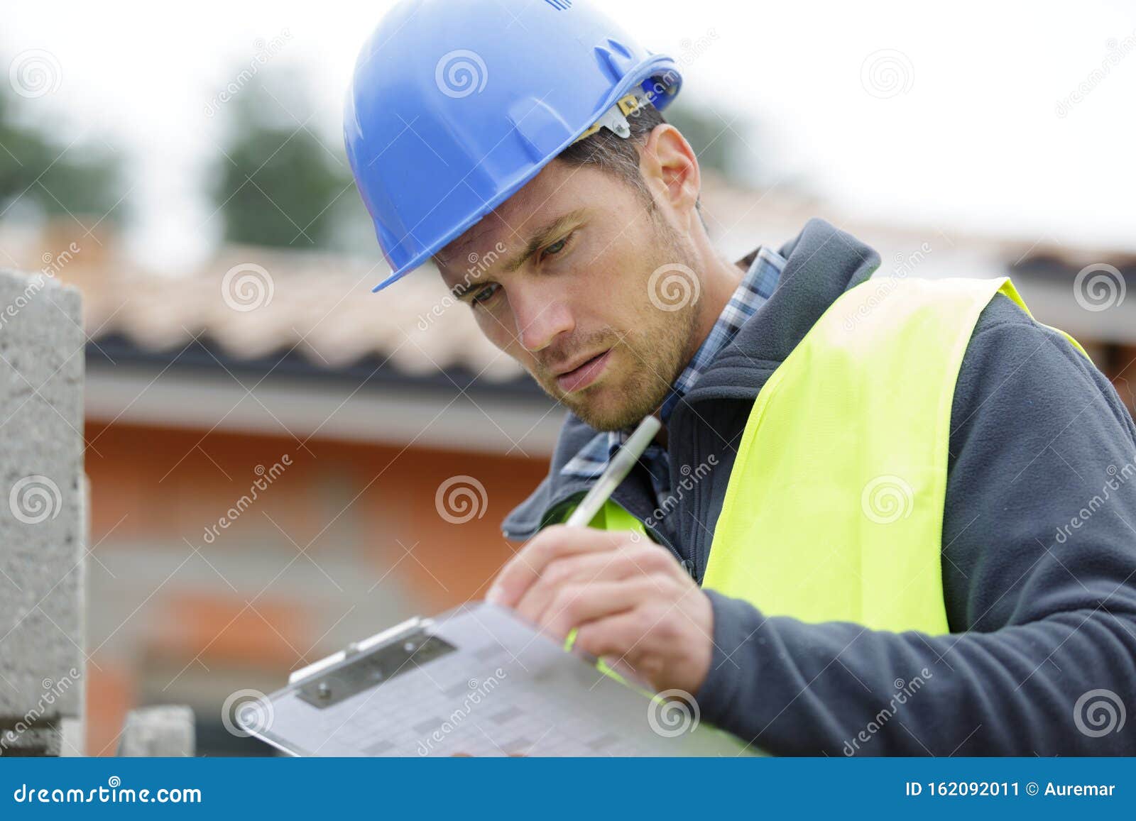 Concentrated Builder Using Clipboard Outdoors Stock Image - Image of ...