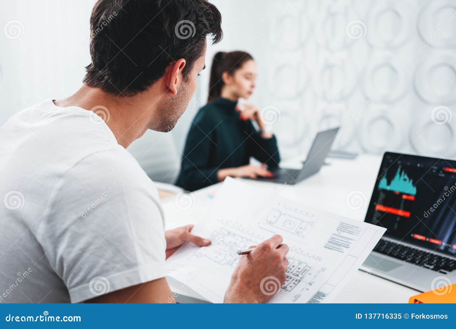 Concentrated Building Designers Working With Drawing Plan And Computer ...