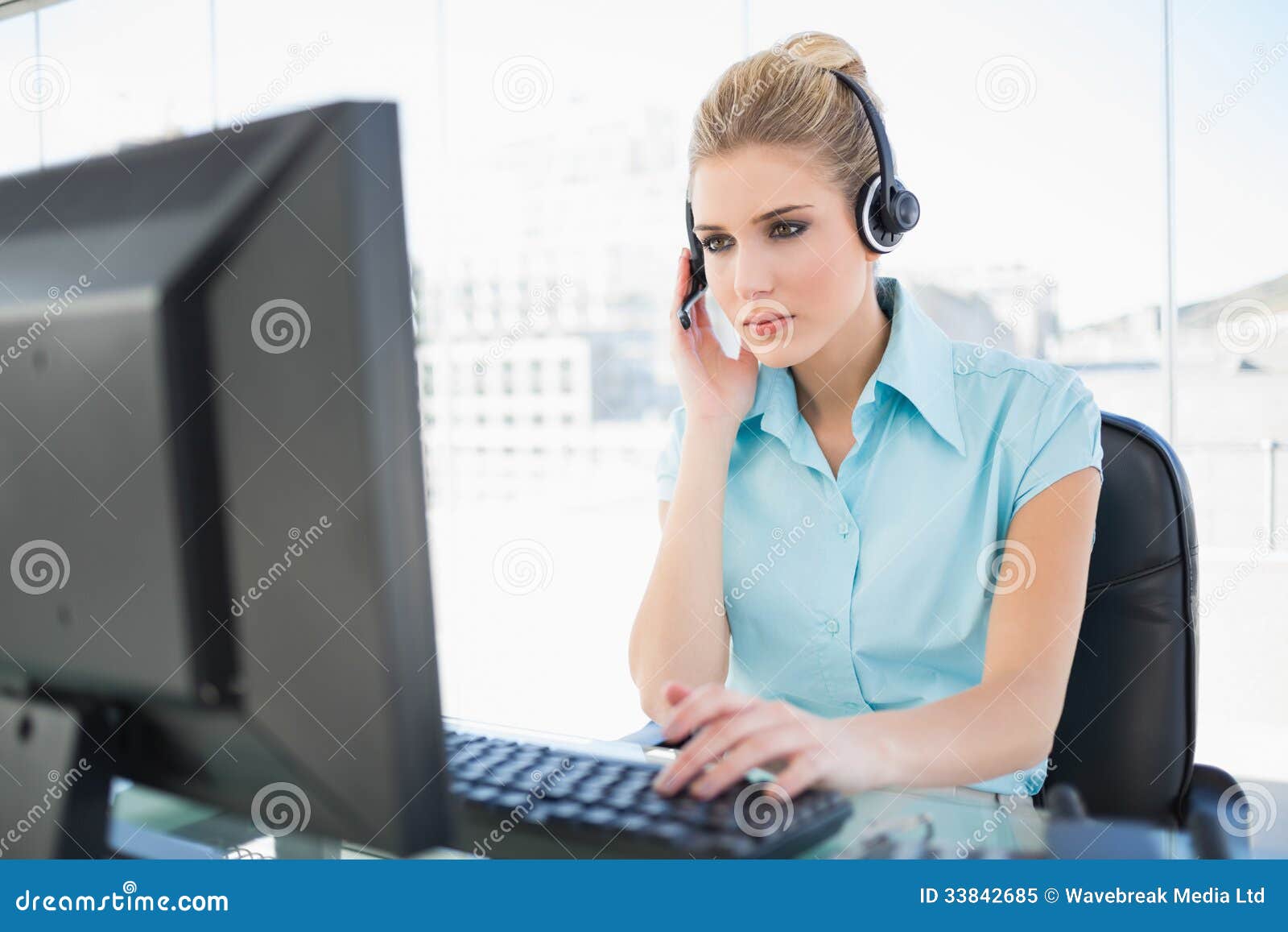 Concentrated Call Centre Agent Working on Computer Stock Image - Image ...