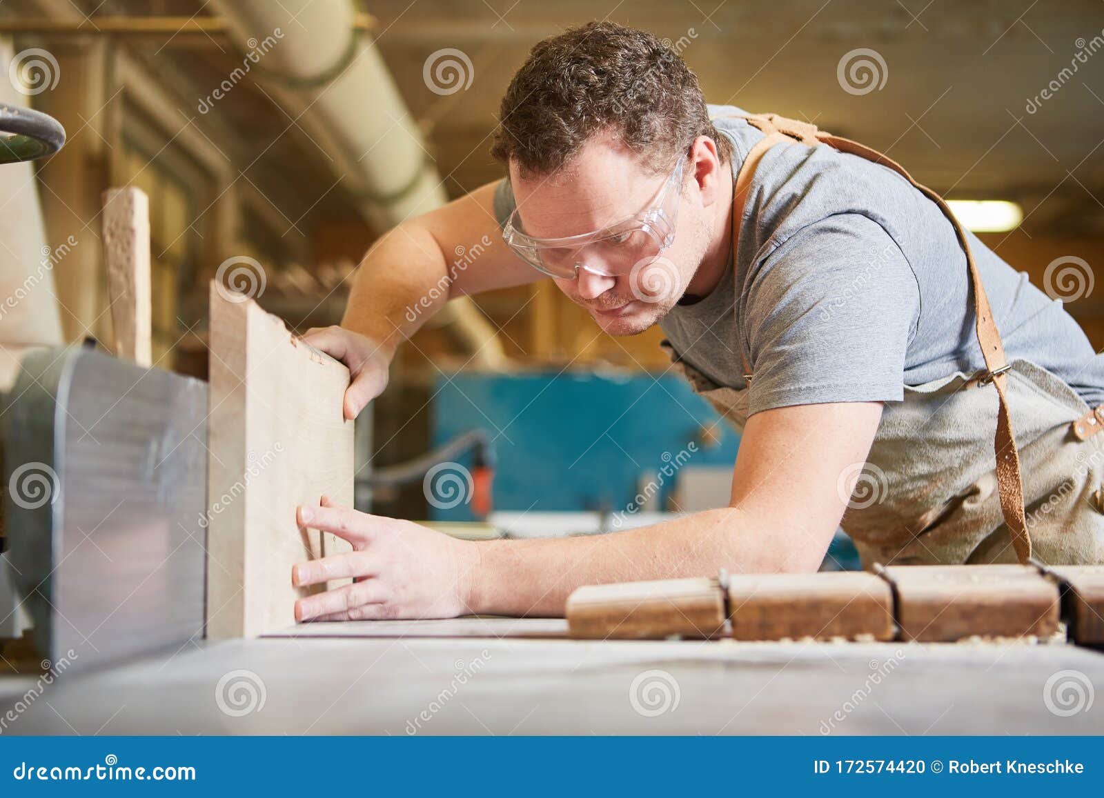 Concentrated Carpenter Planing the Wood Stock Photo - Image of ...