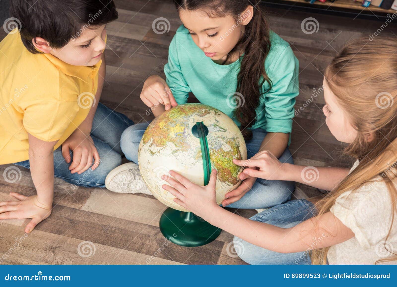 Concentrated Children Exploring Globe in Library Stock Image - Image of ...