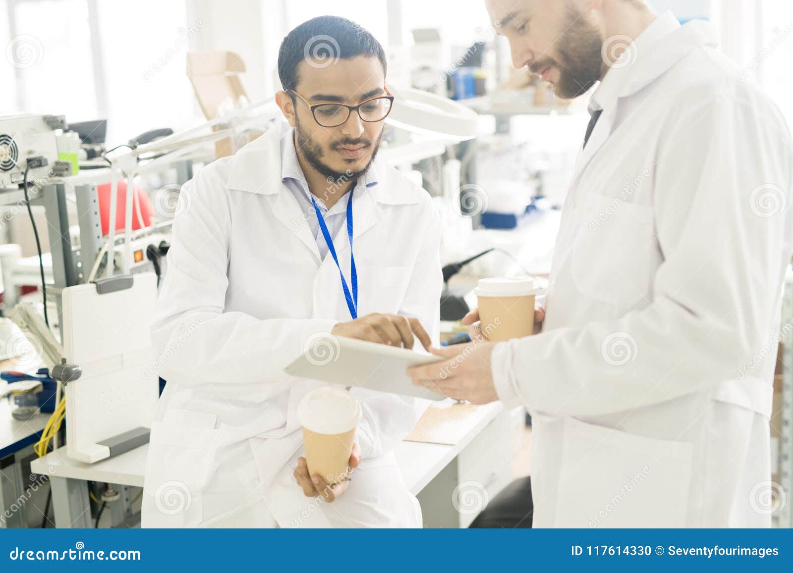 Serious Engineers Analyzing Data on Tablet Stock Photo - Image of ...