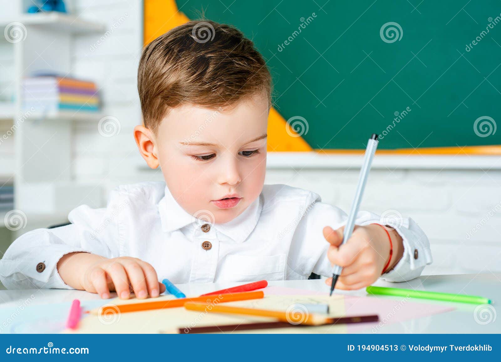 Concentrated Cute Child, Writing in Notebook Using Pencil. Cute Child ...