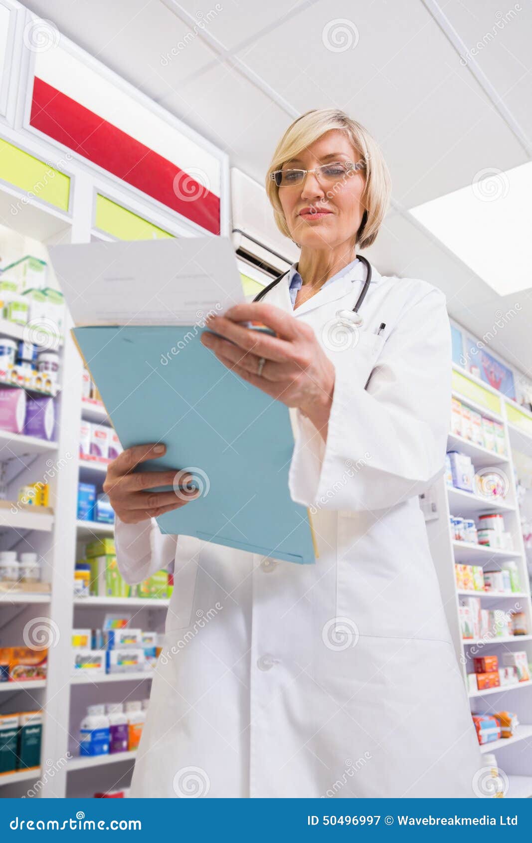 Concentrated Doctor Reading a Prescription Stock Image - Image of ...