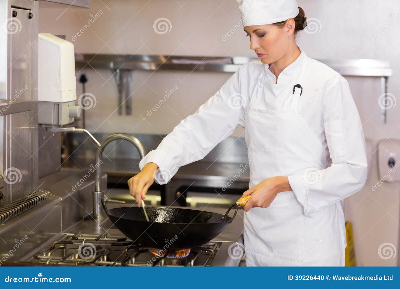 Concentrated Female Chef Preparing Food in Kitchen Stock Photo - Image ...