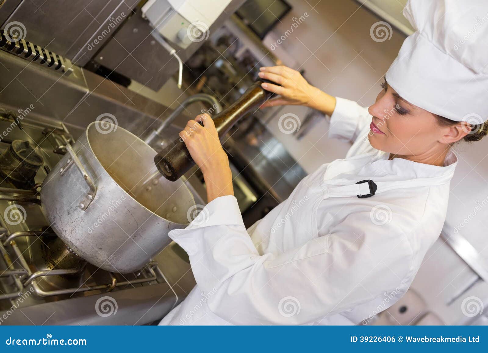 Concentrated Female Cook Preparing Food in Kitchen Stock Photo - Image ...