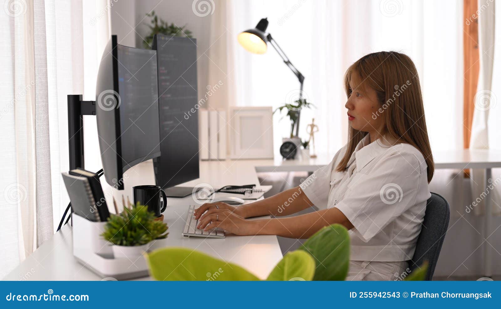 Concentrated Female Software Developer Checking Mistakes In Programming Code On Computer Screen