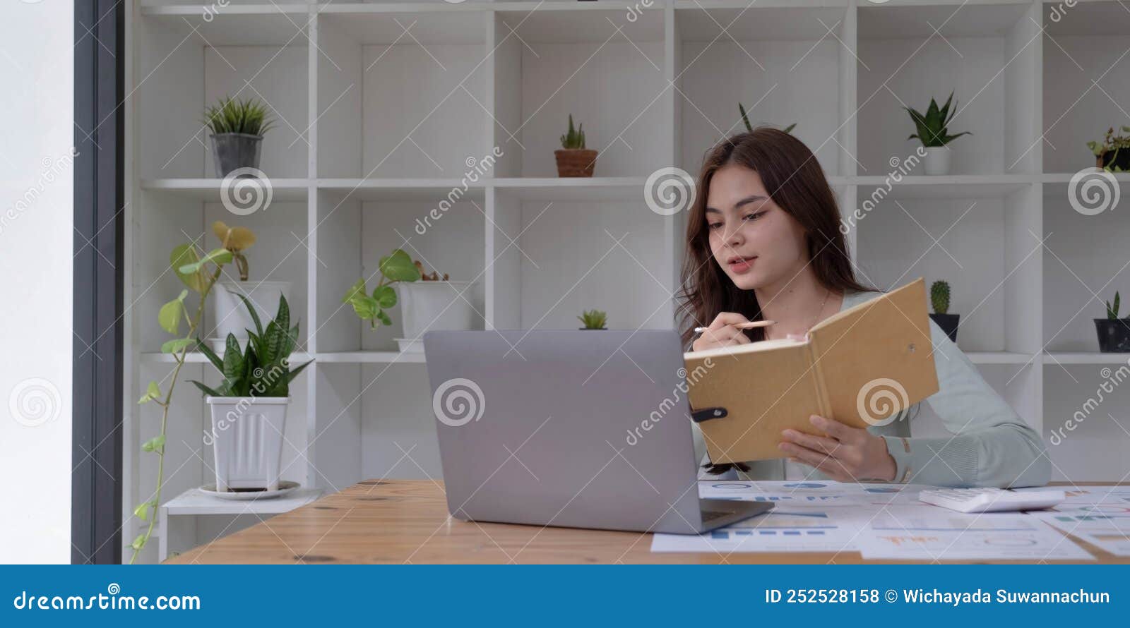 Concentrated Female Student Busy Studying Using Laptop Make Notes in ...