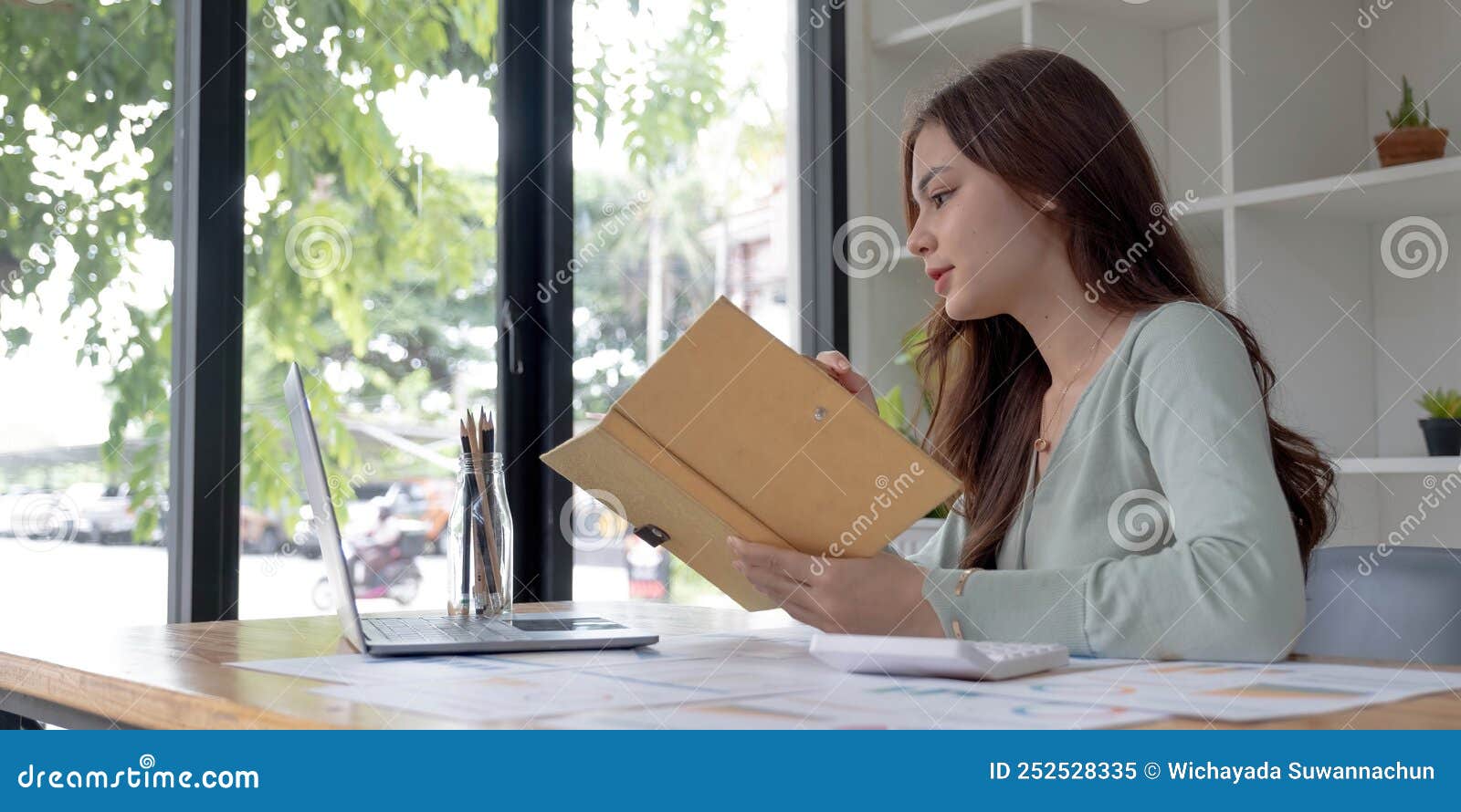 Concentrated Female Student Busy Studying Using Laptop Make Notes in ...
