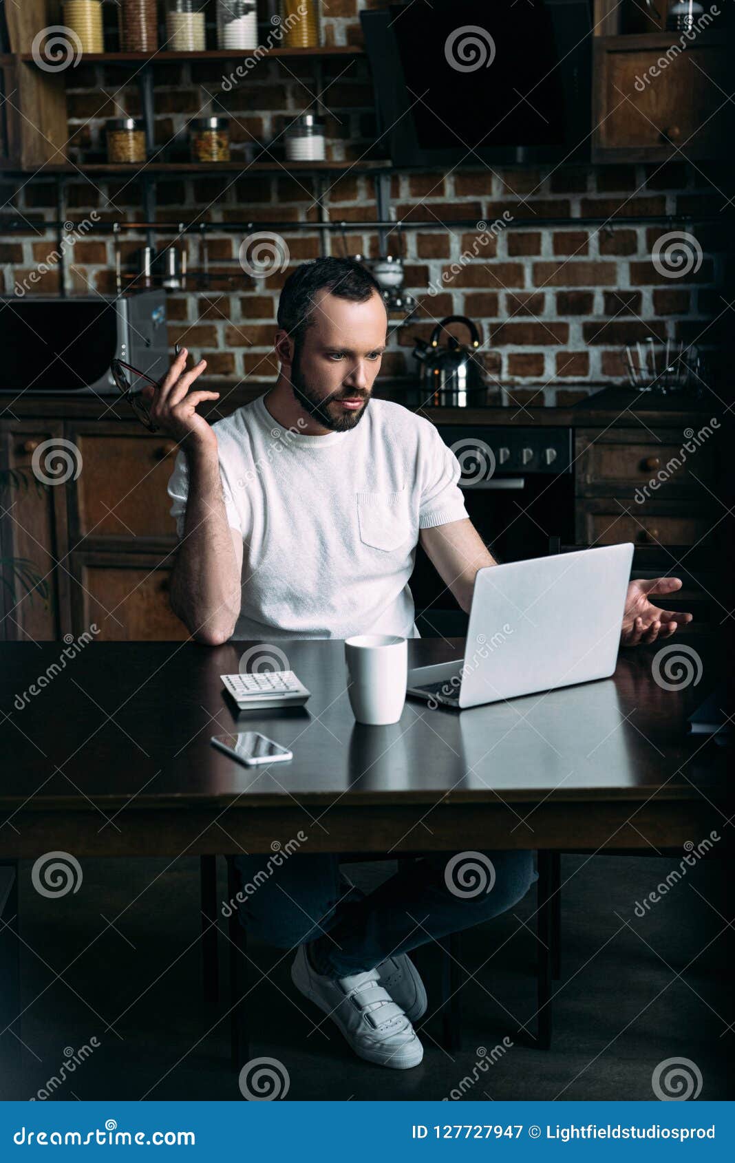 Concentrated Freelancer Remote Working at Table with Laptop Stock Image ...