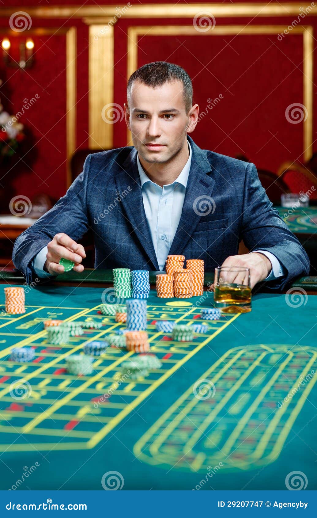 Concentrated Gambler Playing Roulette at the Casino Stock Image - Image ...