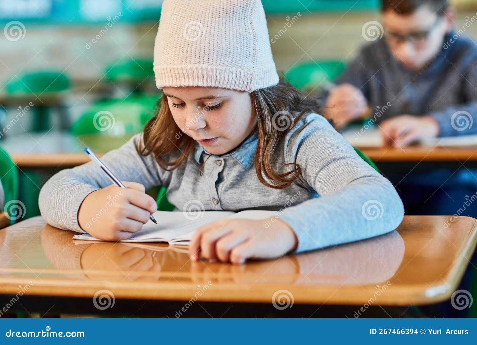 Concentrated on Getting Her Schoolwork Done. an Elementary School Girl ...