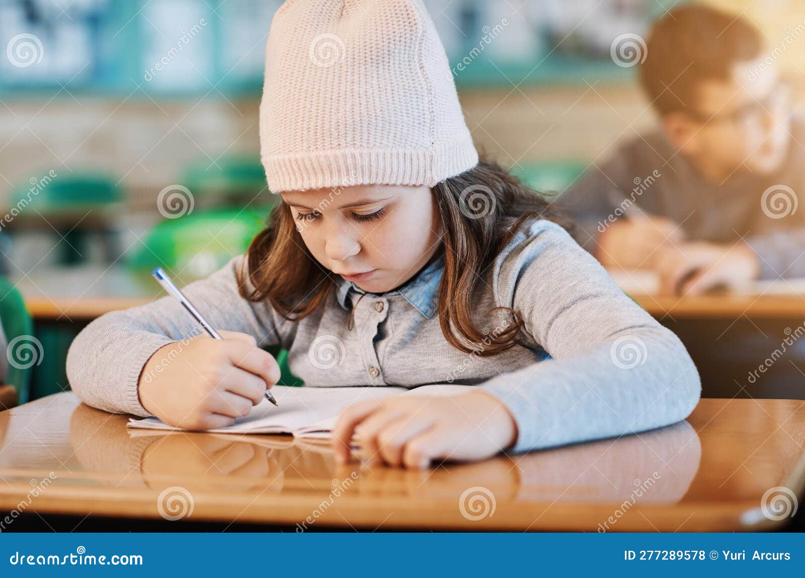 Concentrated on Getting Her Schoolwork Done. an Elementary School Girl ...