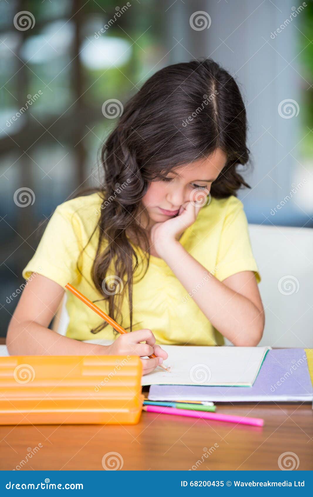 Concentrated Girl Studying while Sitting at Desk Stock Image - Image of ...