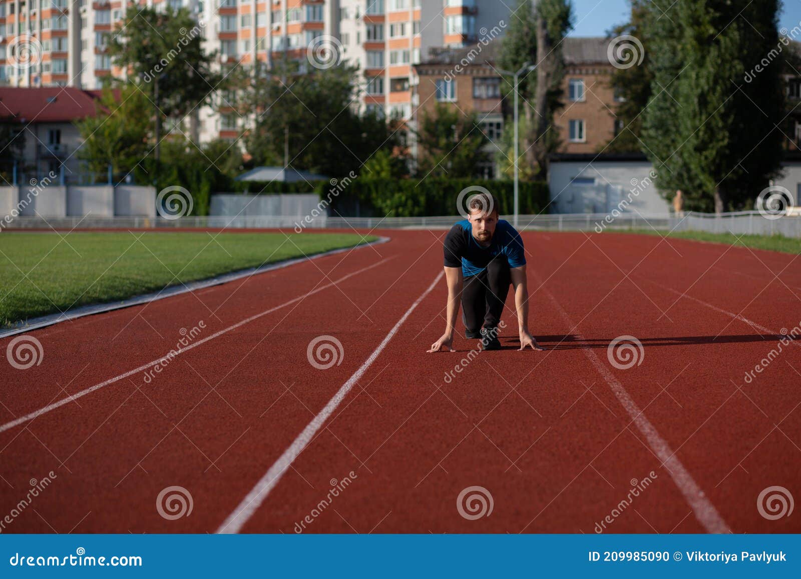 Concentrated Guy is Ready To Run at the Stadium Stock Photo - Image of ...
