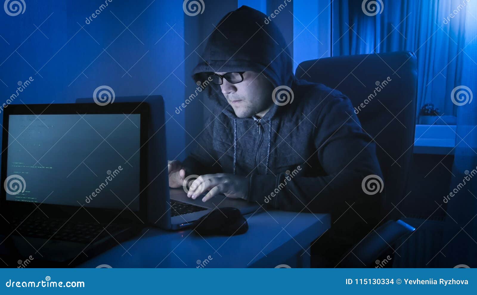 Portrait Of Concentrated Hacker Typing Code Of Computer Virus On Laptop