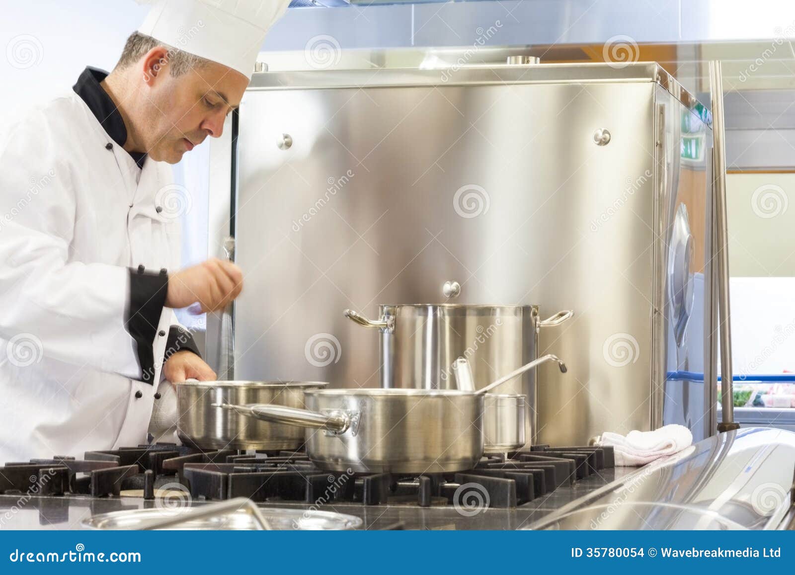 Concentrated Head Chef Stirring in Pot Stock Photo - Image of cooking ...