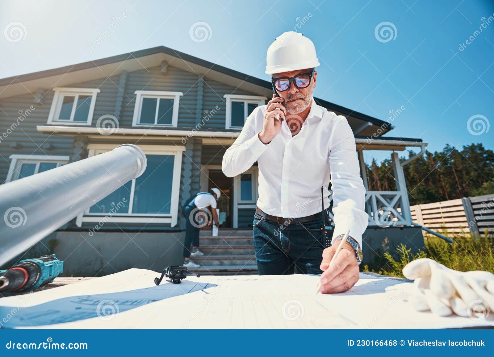 Concentrated Housebuilder Making Notes on House Layout Stock Photo ...