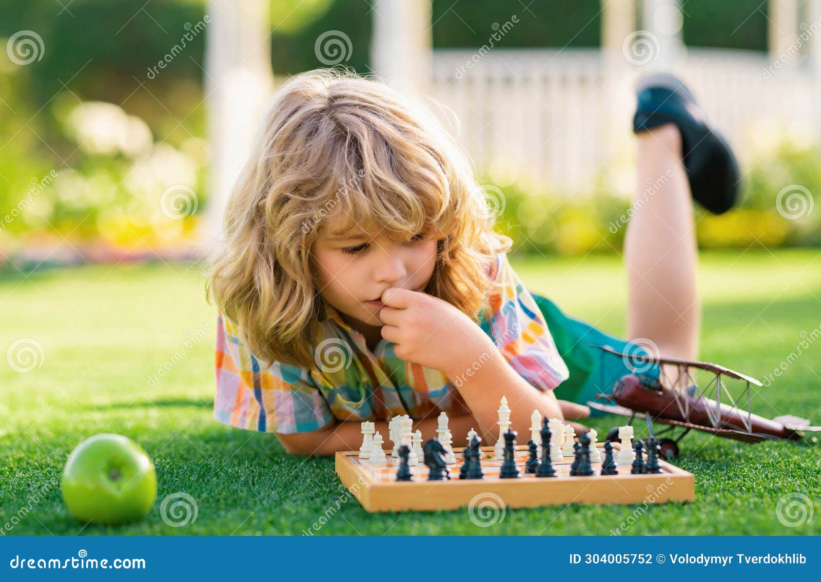 Concentrated Kid Developing Chess Strategy, Playing Board Game in ...