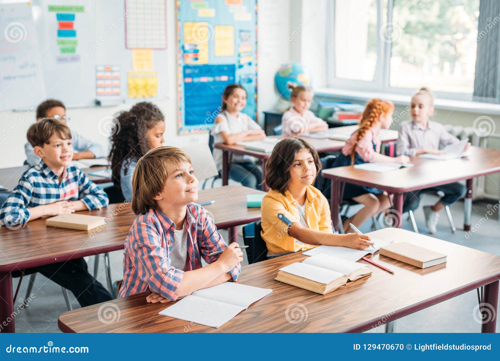 Concentrated kids in class stock photo. Image of pupils - 129470670