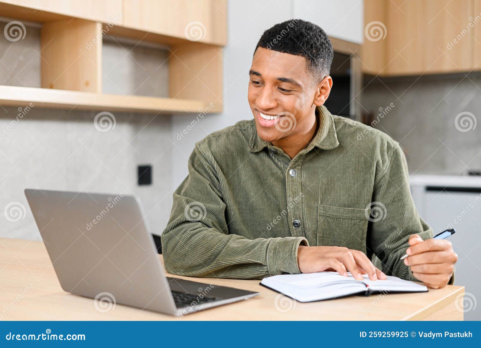 Concentrated Latin Businessman Looking at the Laptop Display, Solving ... Concentrated Latin Businessman Looking at the Laptop Display, Solving ...