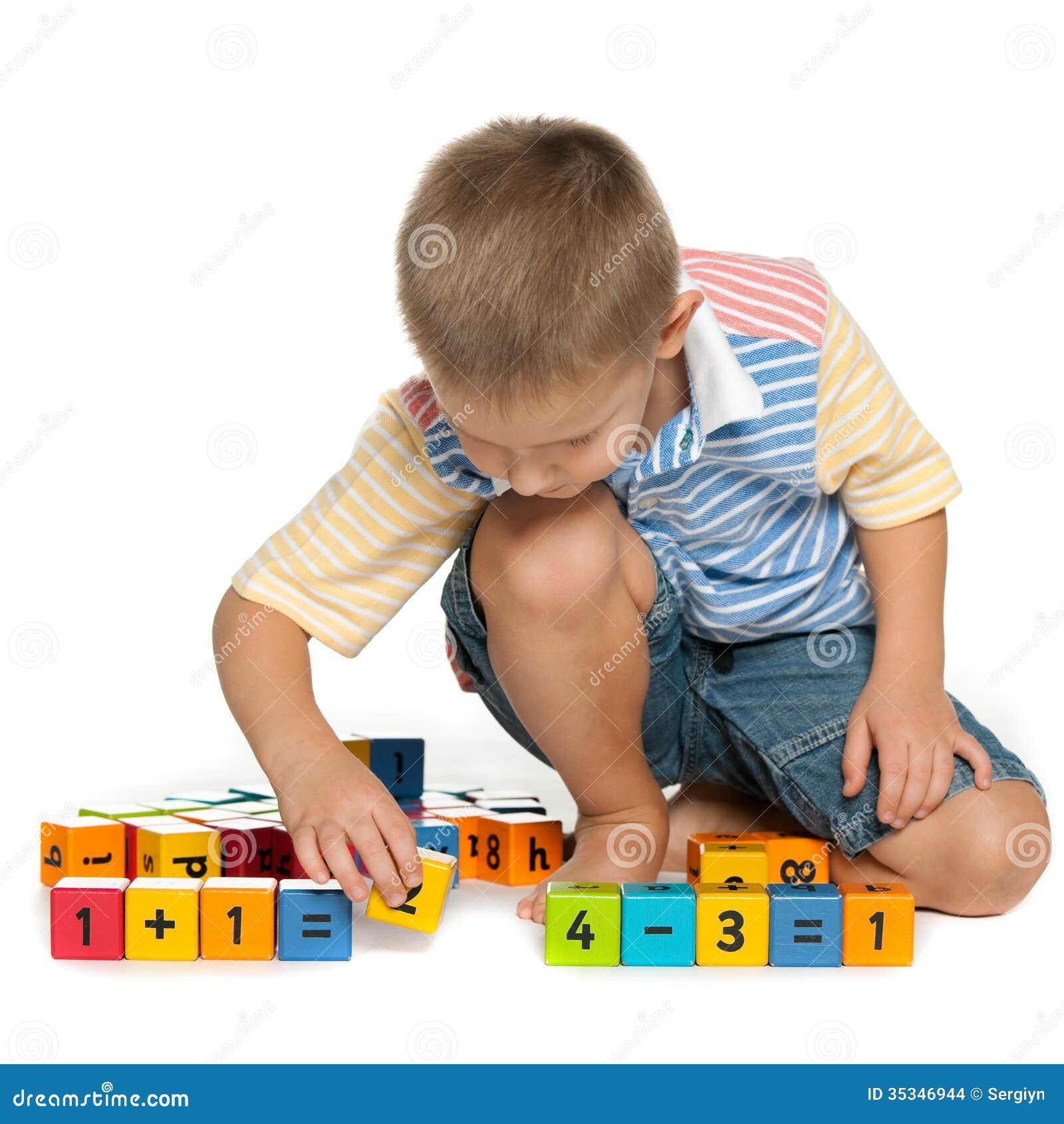Concentrated Little Boy with Blocks on the Floor Stock Photo - Image of ...