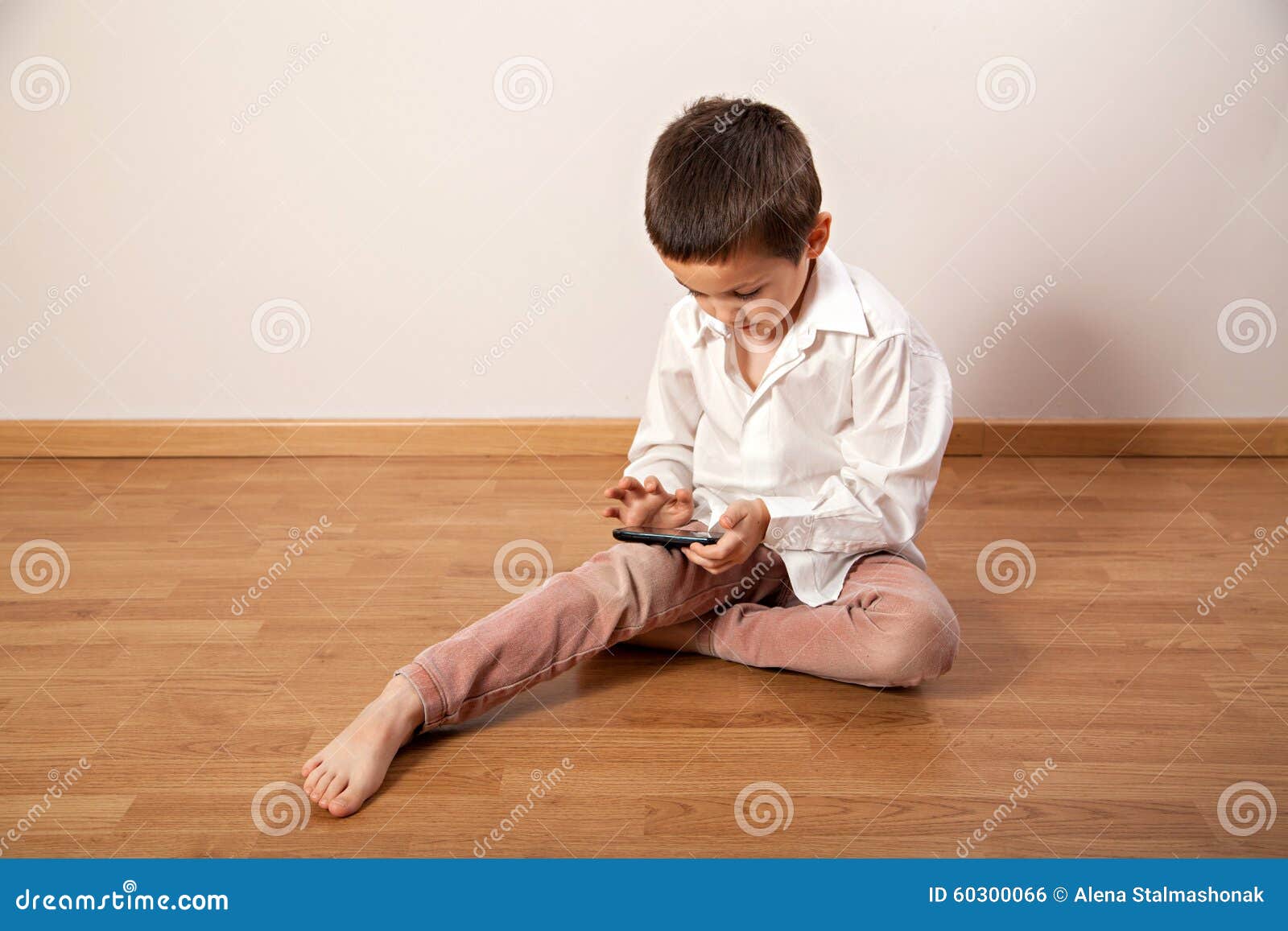 Concentrated Little Boy Playing with Smartphone Stock Photo - Image of ...
