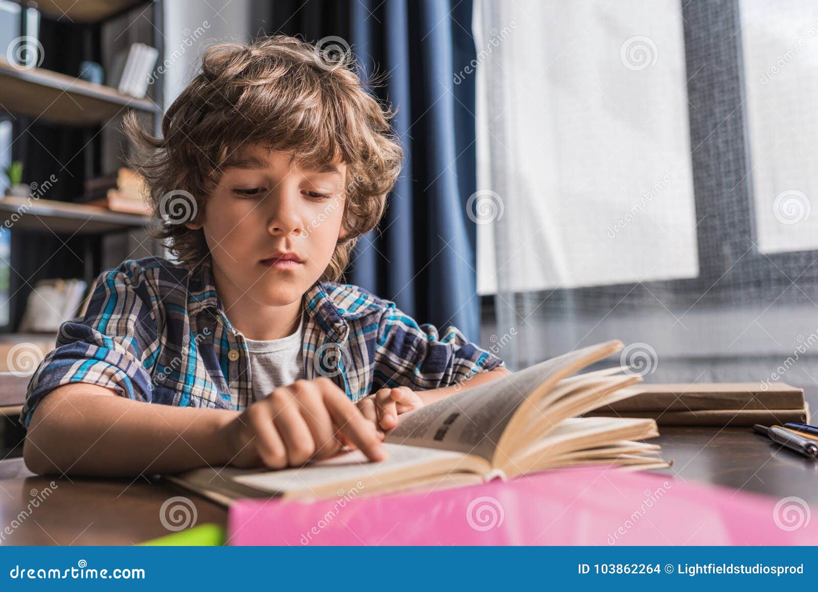 Kid reading book stock photo. Image of study, homework - 103862264