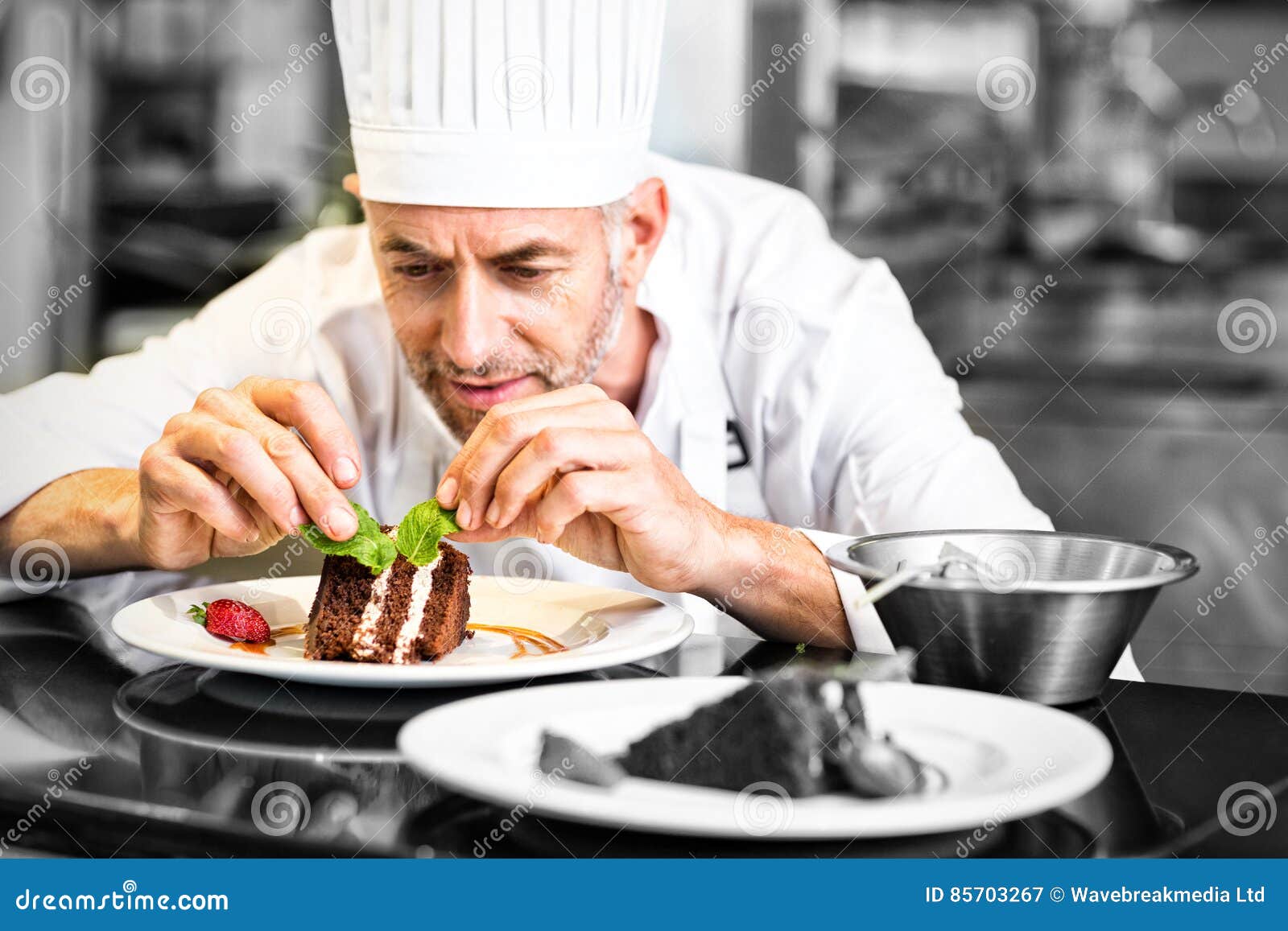Concentrated Male Pastry Chef Decorating Dessert in Kitchen Stock Image ...