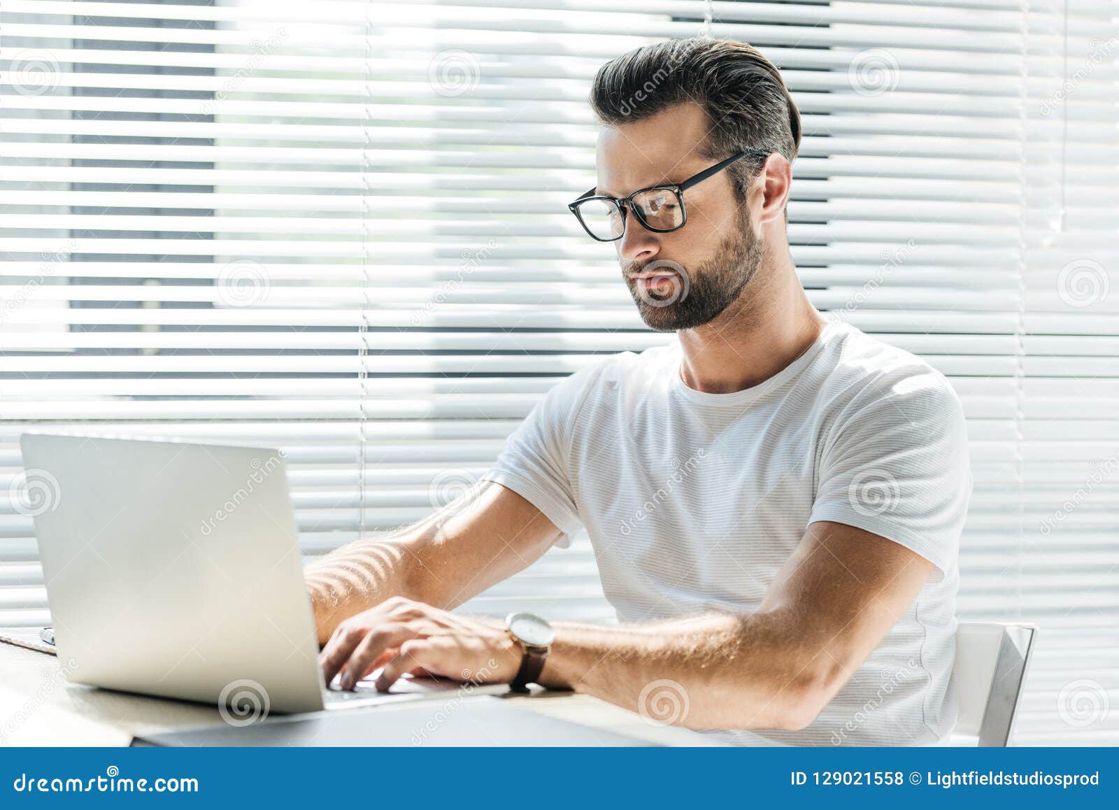 Concentrated Man in Eyeglasses Using Laptop Stock Photo - Image of ...