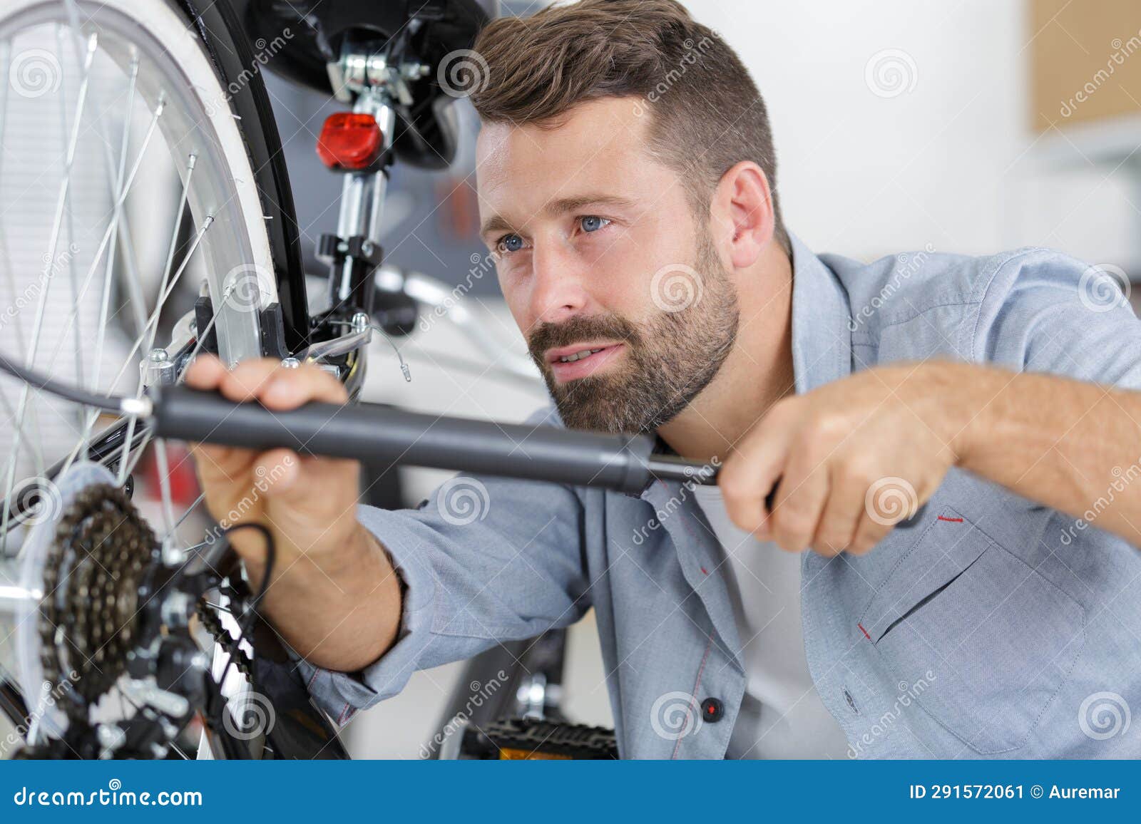 Concentrated Man Fixing Wheel Stock Image - Image of task, repairing ...