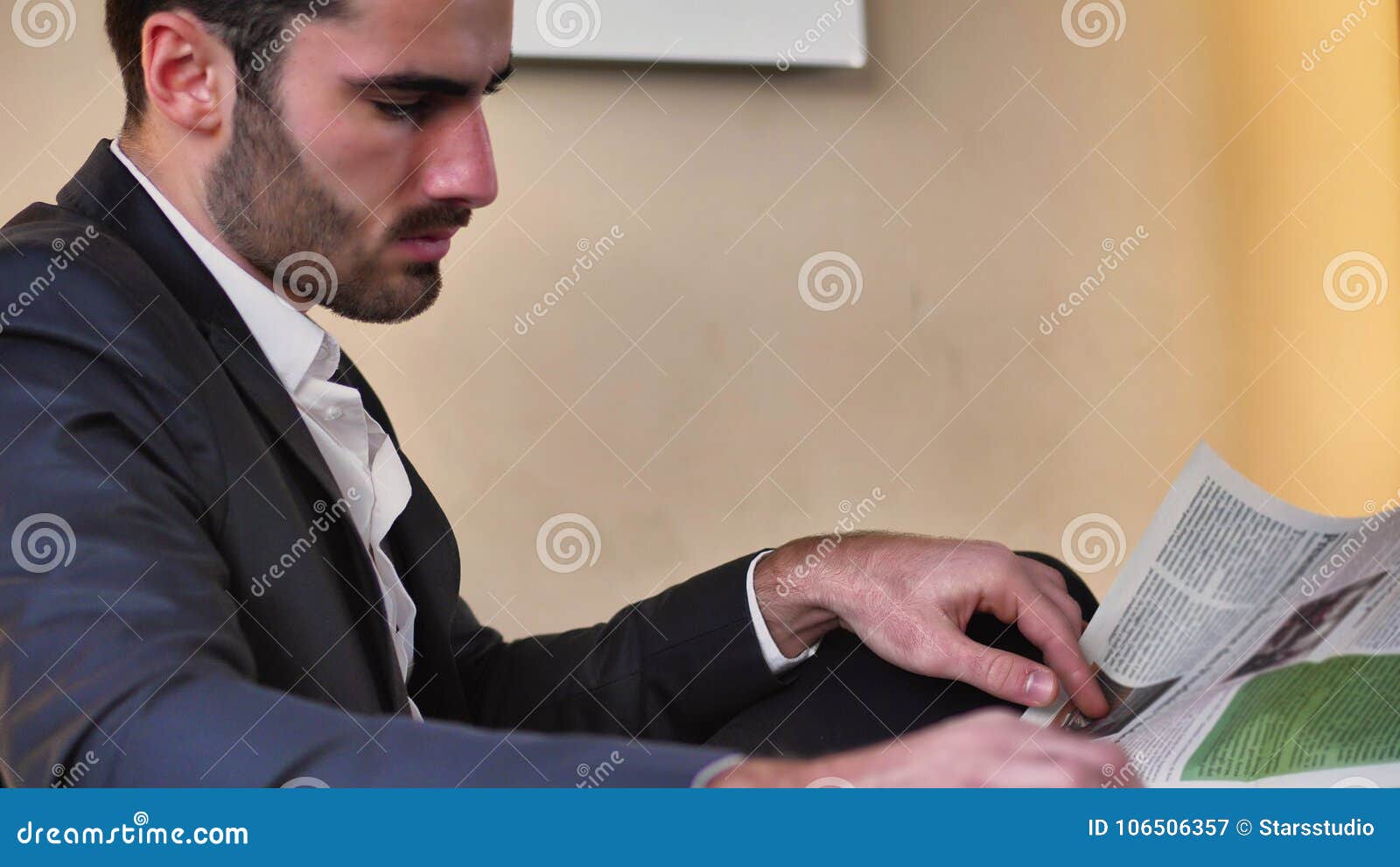 Concentrated Man Looking through Newspaper at Work Stock Image - Image ...