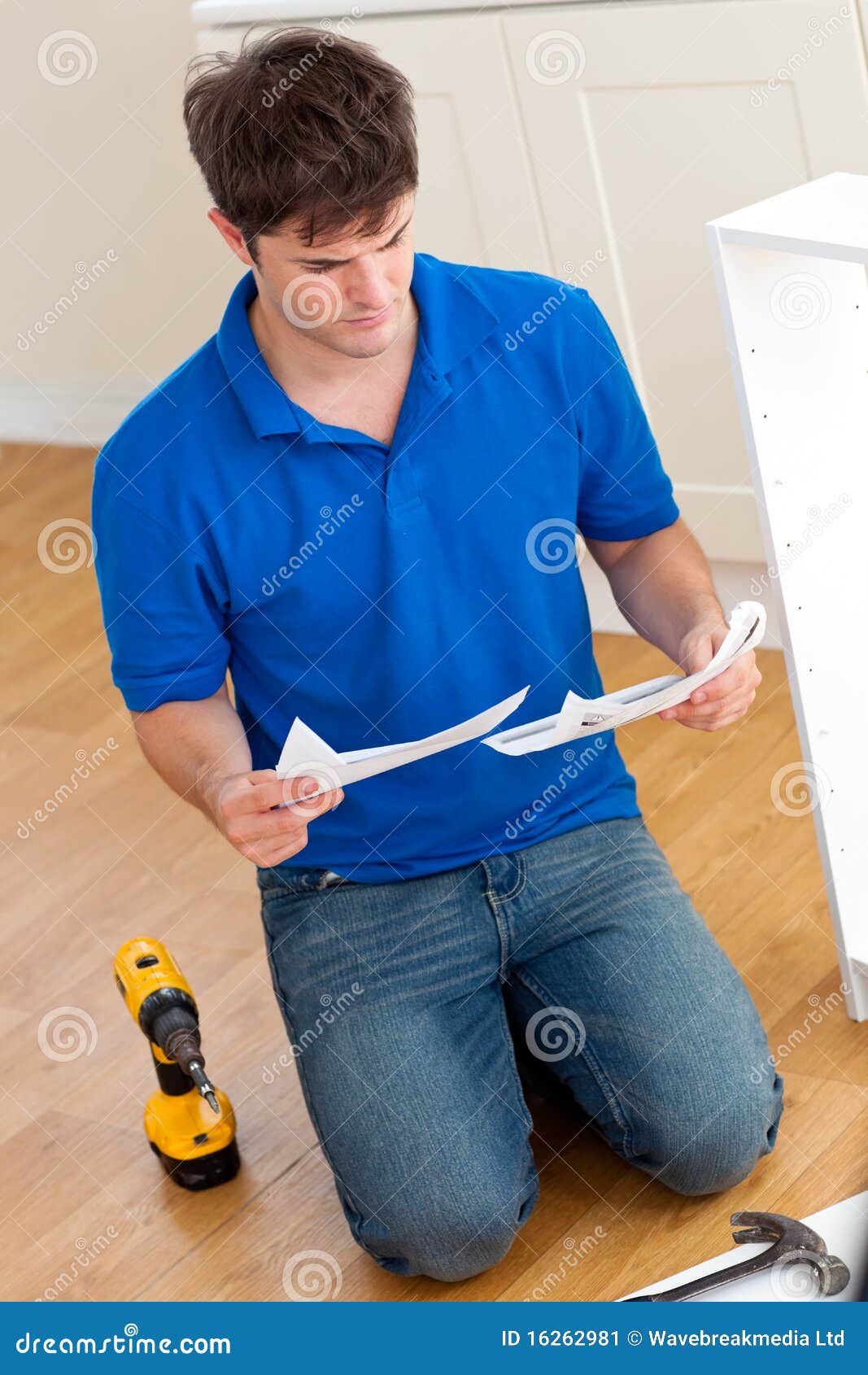 Concentrated Man Reading Instructions of Furniture Stock Image - Image ...
