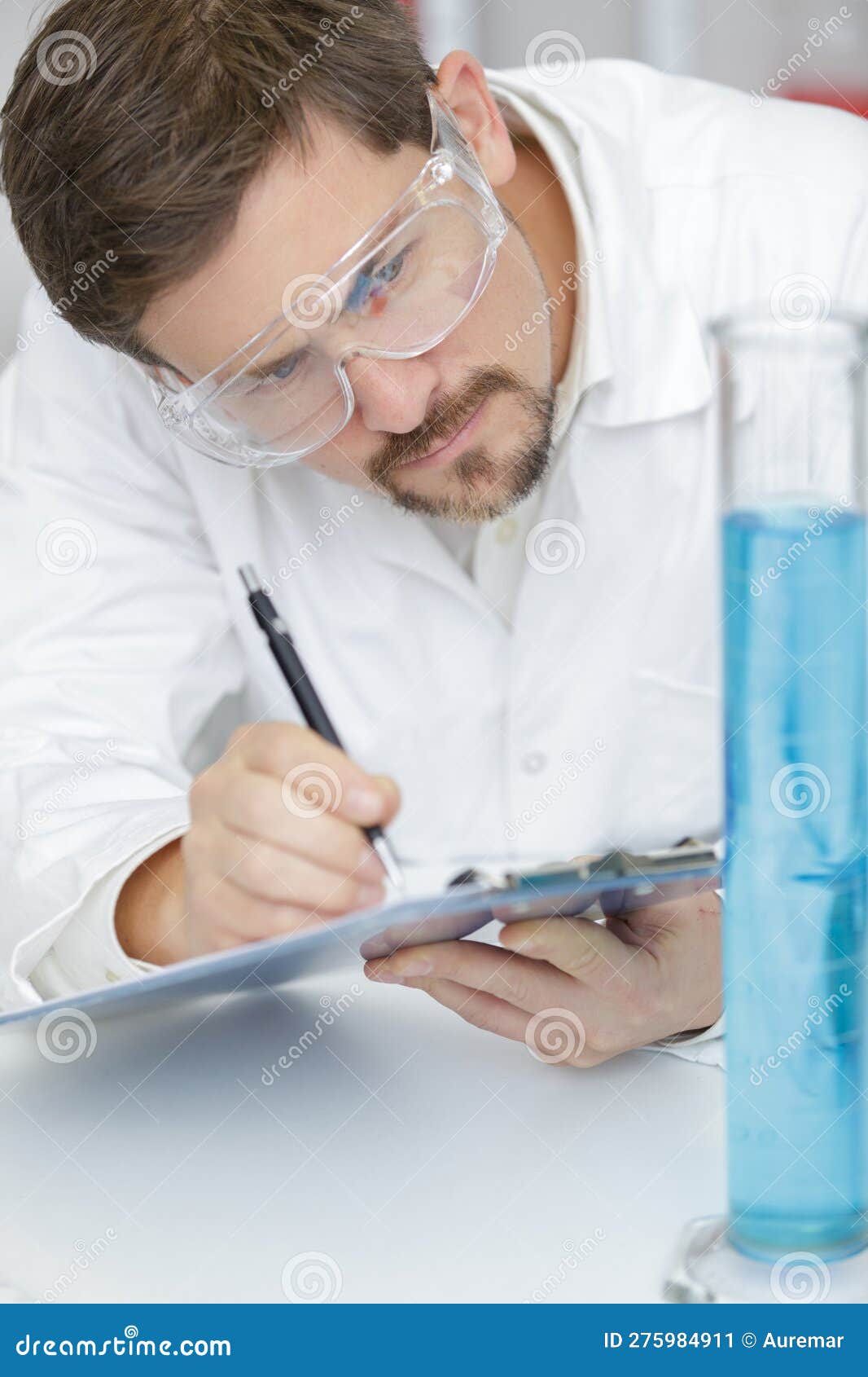 Concentrated Man Scientist Taking Notes in Lab Stock Image - Image of ...