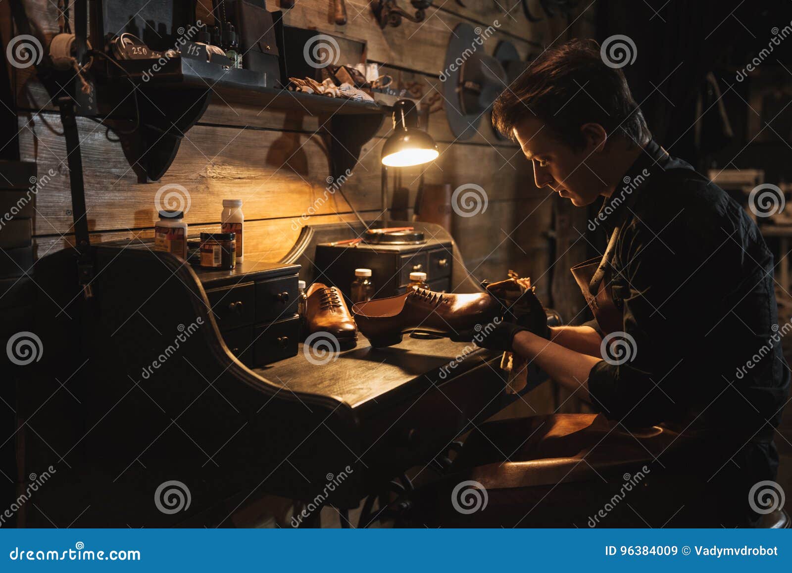 Concentrated Man Shoemaker at Footwear Workshop. Stock Image - Image of ...
