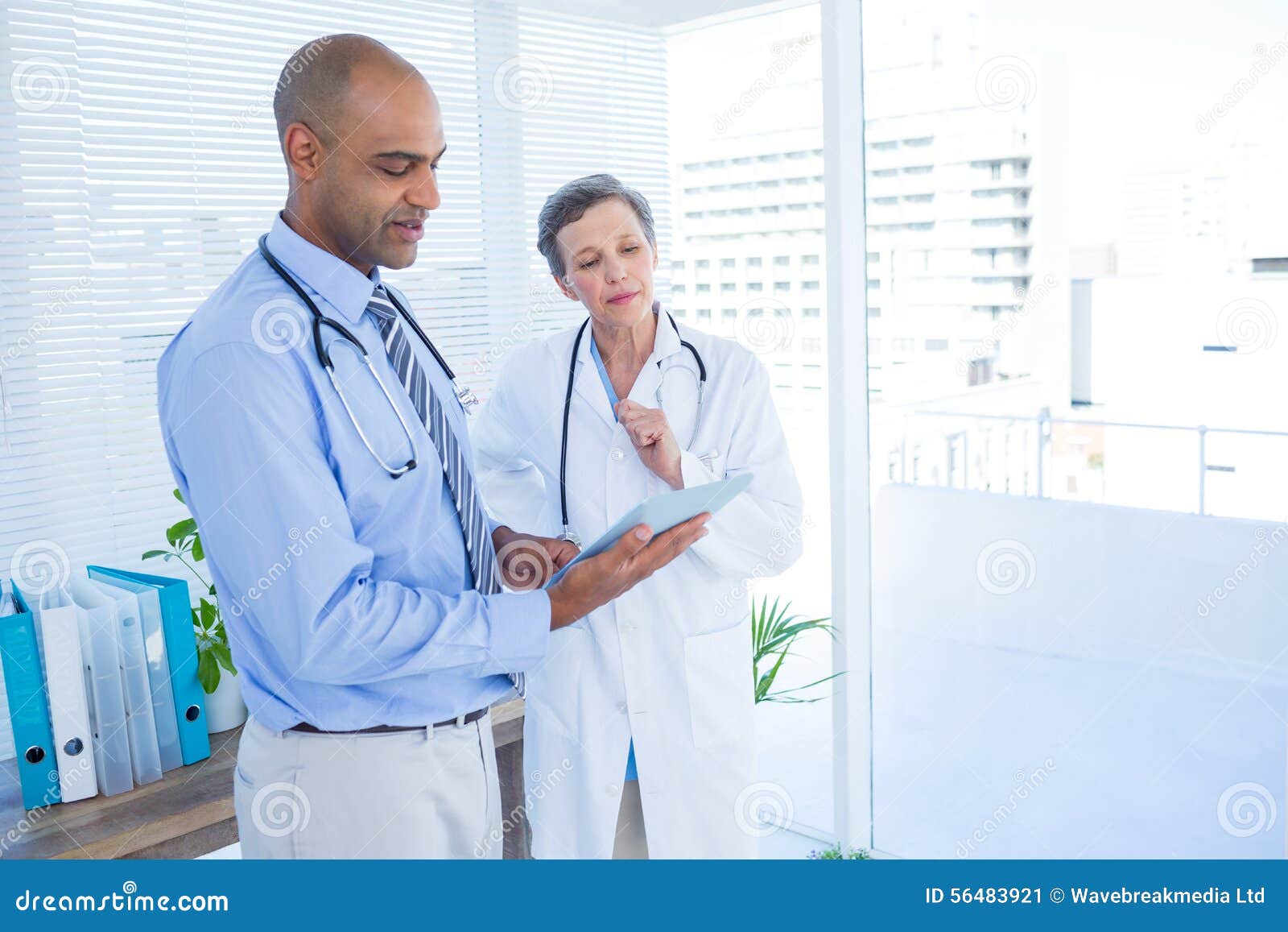 Concentrated Medical Colleagues Working with Tablet Computer Stock ...