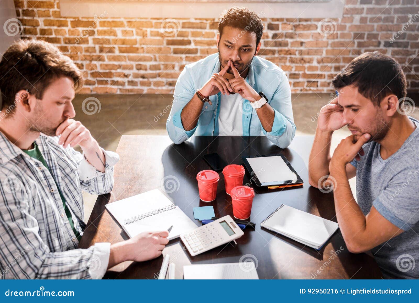 Concentrated Men Working on Project at Small Office Meeting Stock Photo ...