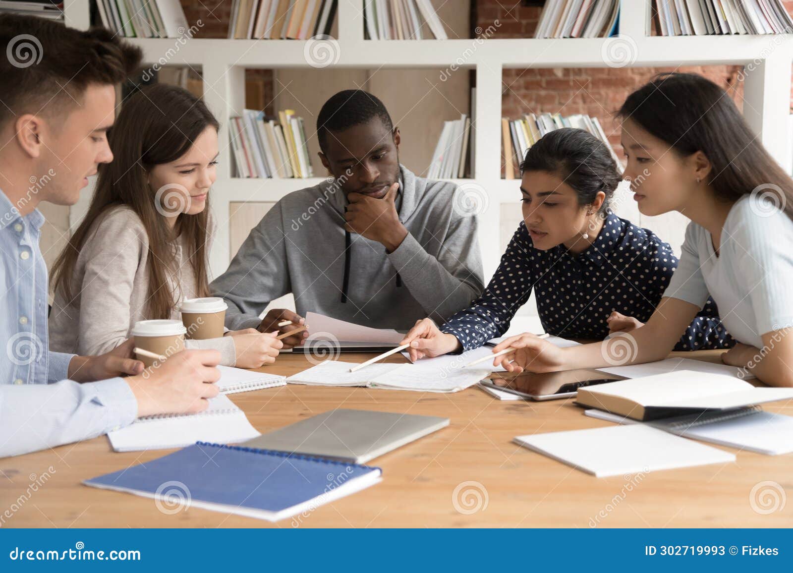 Focused Diverse Multiracial Students Work on Group Project Stock Image ...