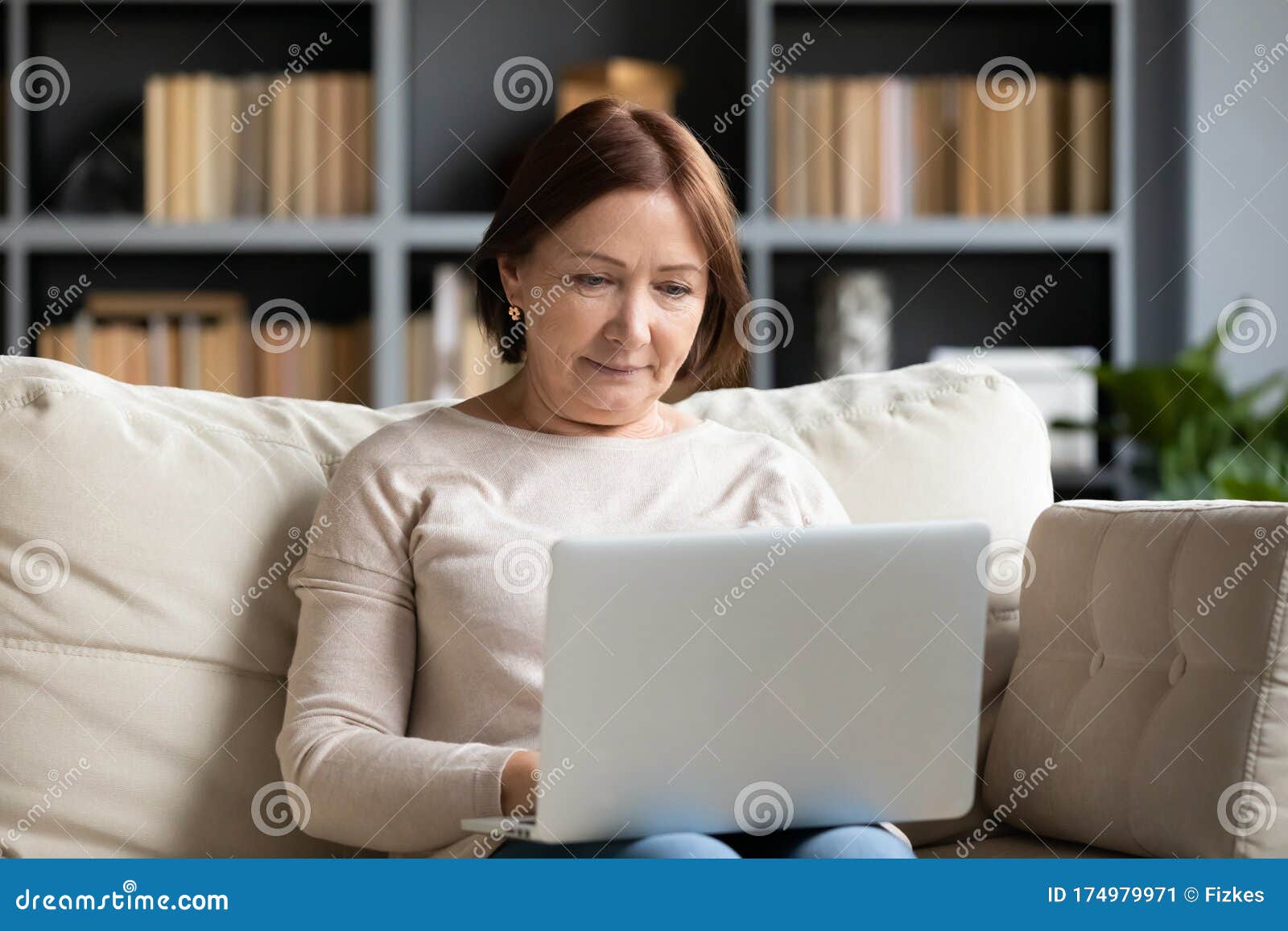 Concentrated Pleasant Mature Older Woman Looking at Computer Screen ... Concentrated Pleasant Mature Older Woman Looking at Computer Screen ...