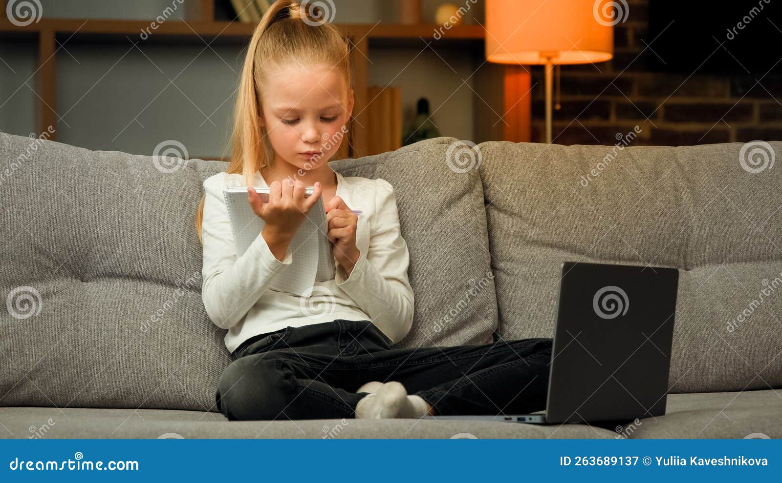 Concentrated Pupil Girl Making Homework at Copybook on Cosy Sofa ...