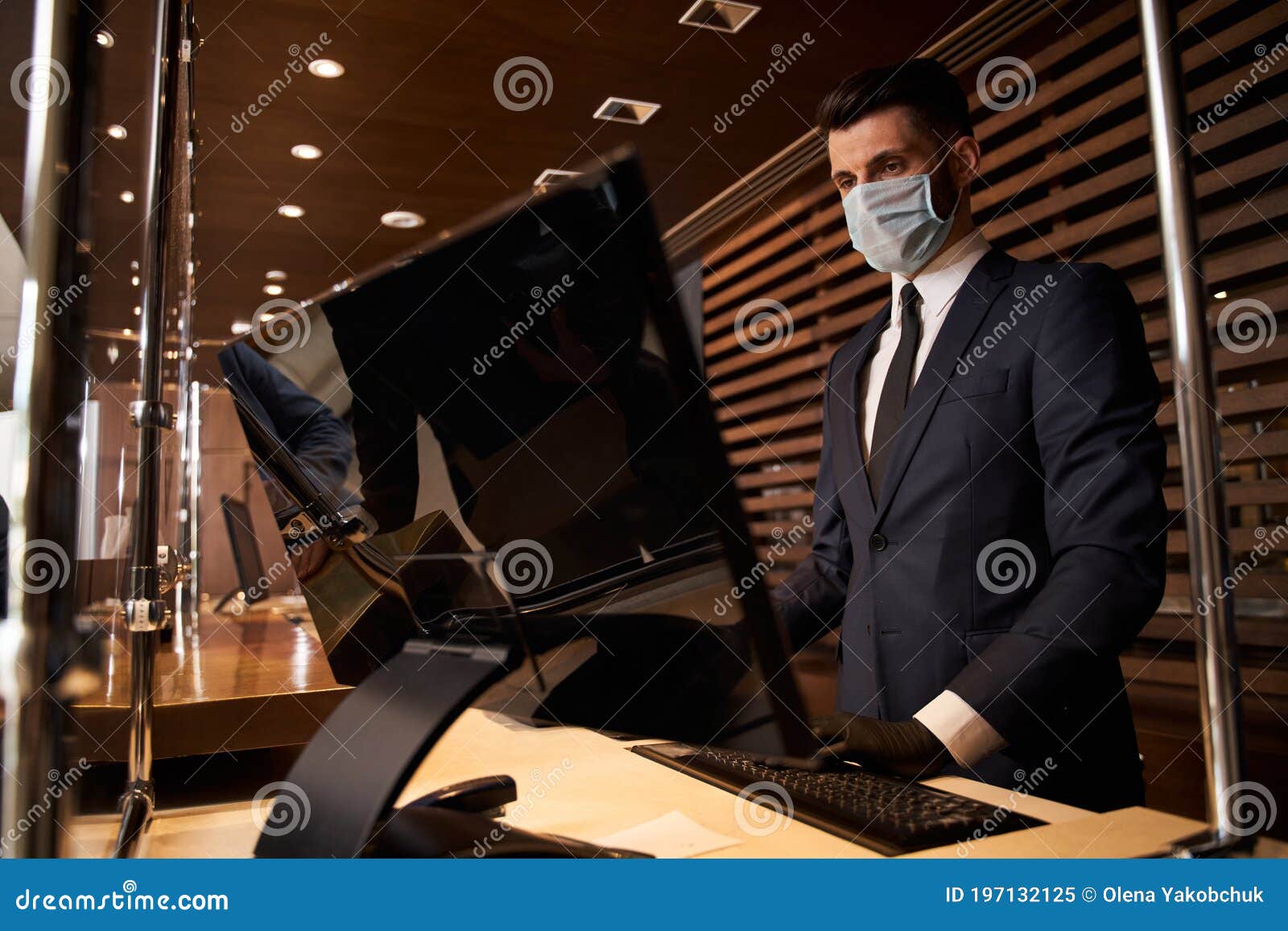 Concentrated Receptionist Using Computer at His Workplace Stock Image ...